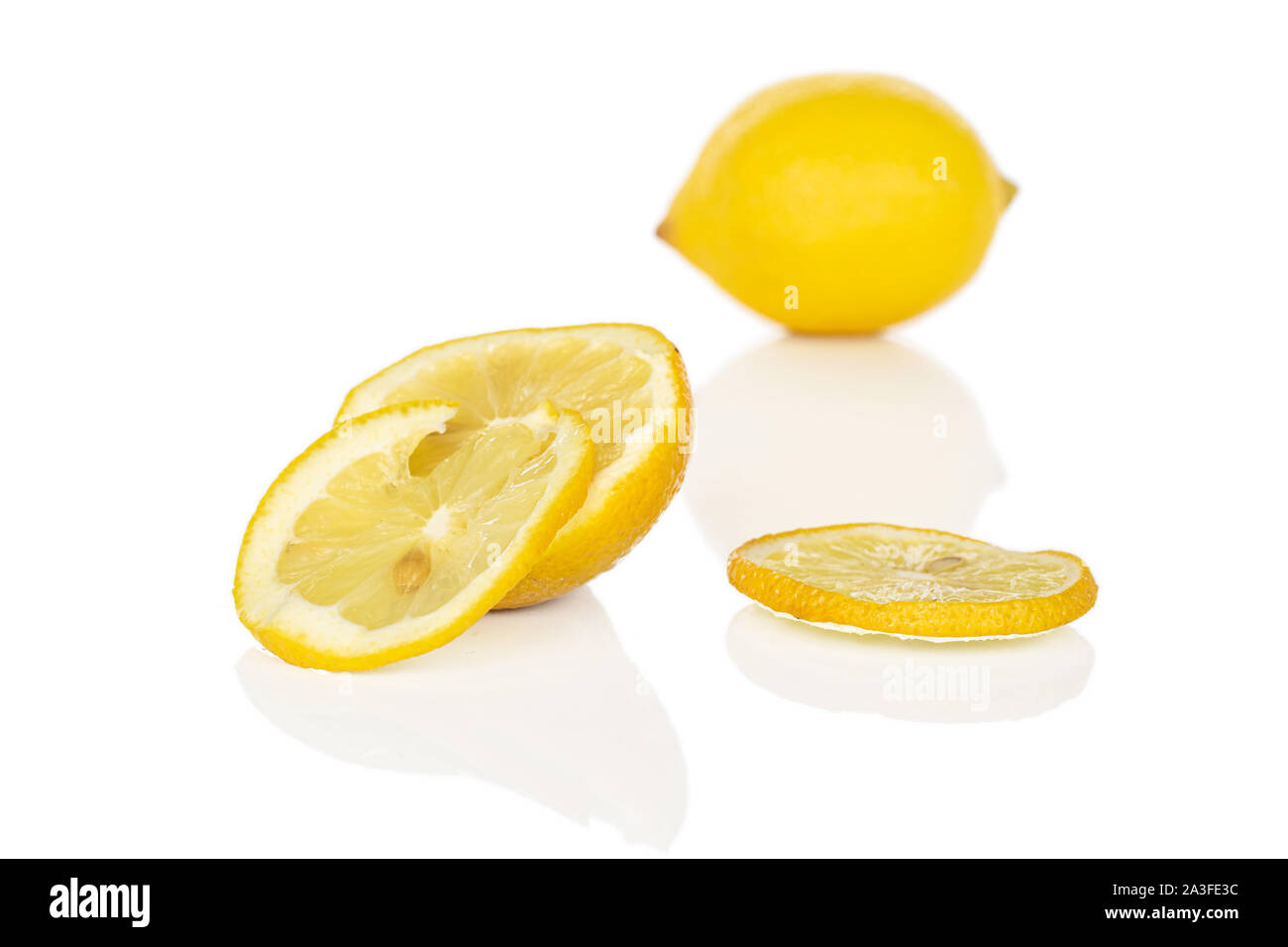 Group of one whole one half two slices of fresh yellow lemon isolated ...