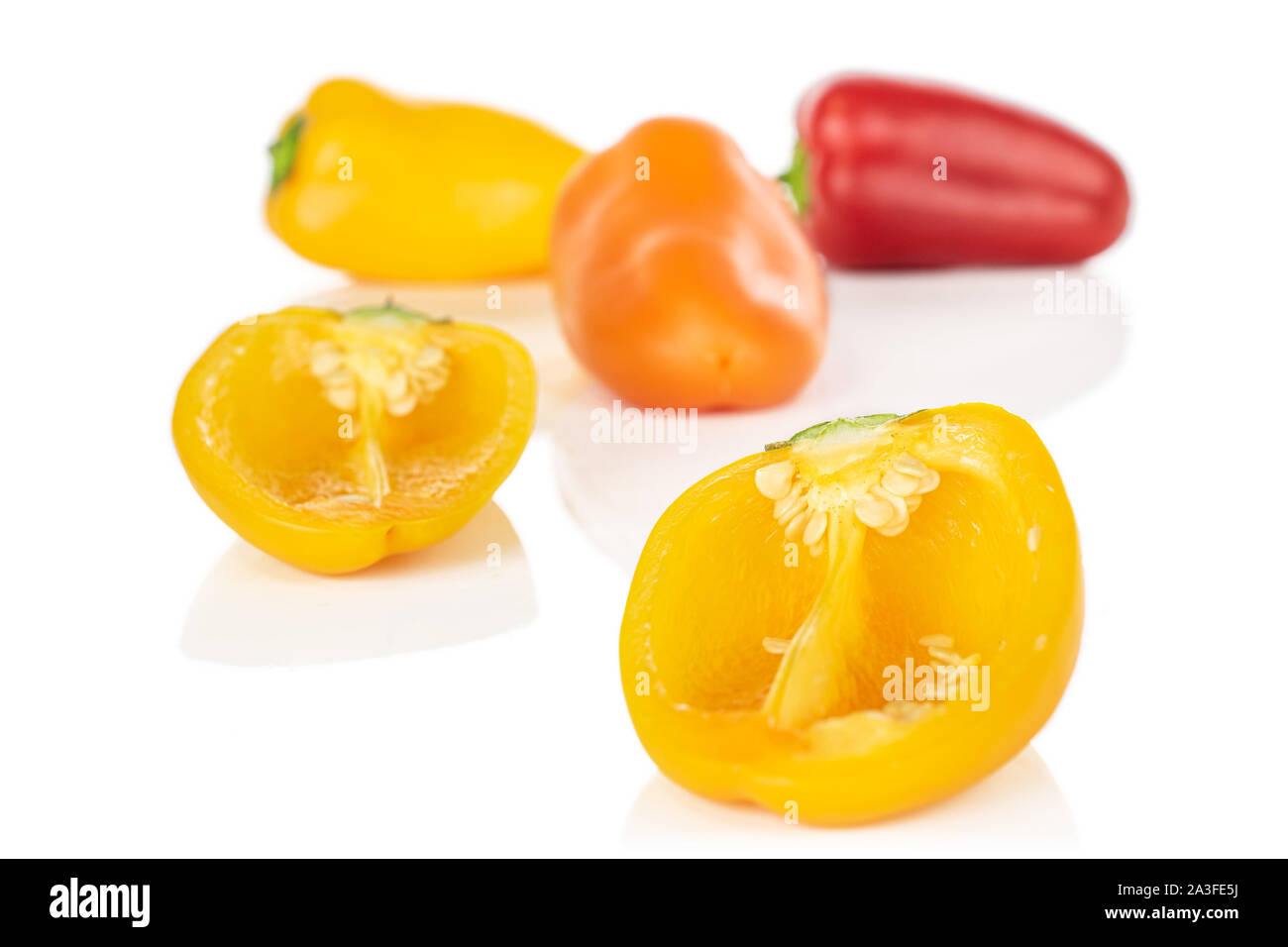 Group of three whole two halves of fresh pepper isolated on white ...