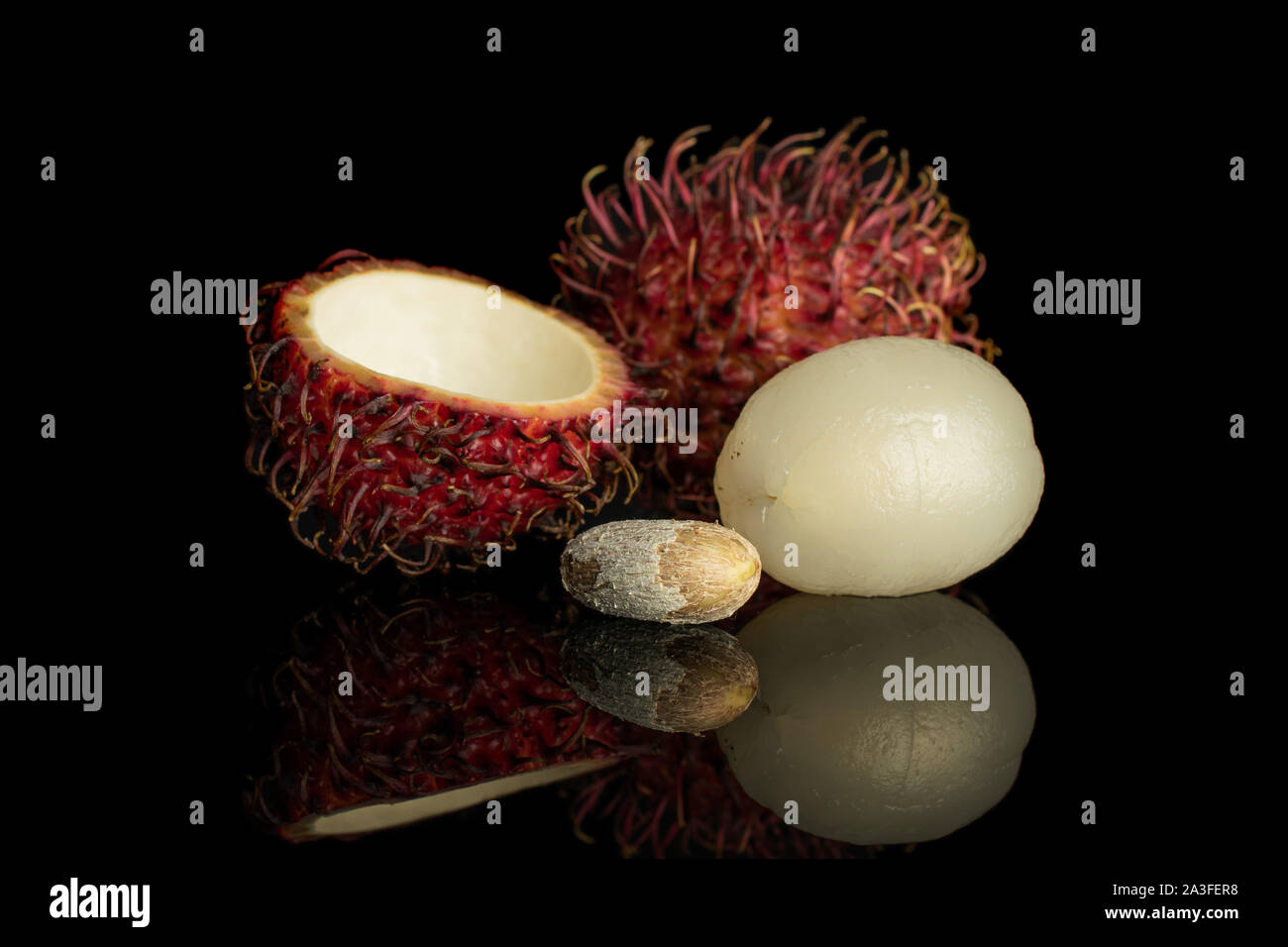 Group of two whole one half one piece of fresh red rambutan isolated on ...