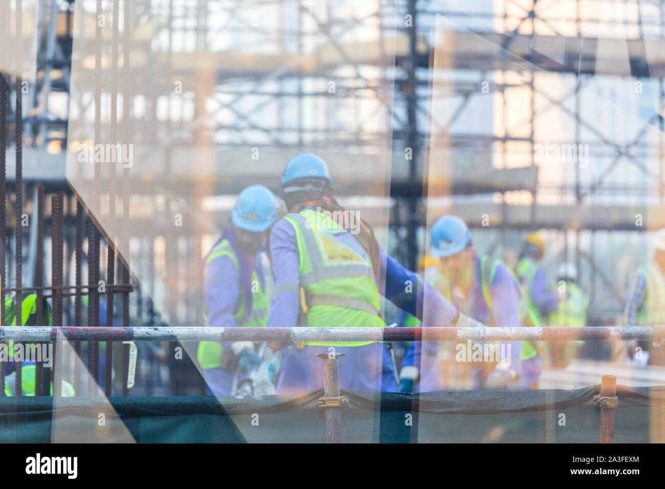 Labor workers working on a construction site Stock Photo - Alamy