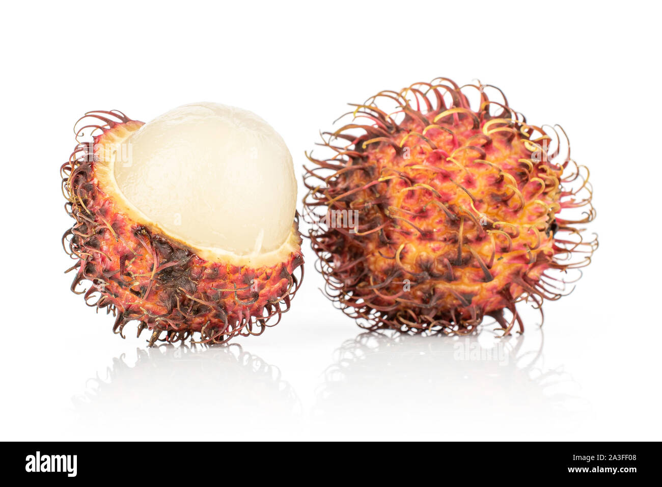 Group of one whole one half of fresh red rambutan isolated on white ...