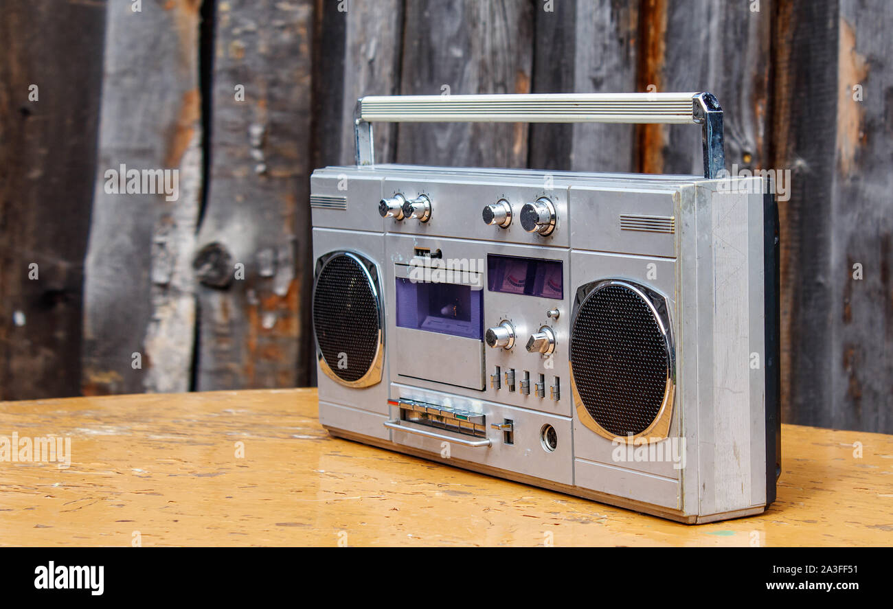 retro cassette player on wooden table outdoor closeup Stock Photo - Alamy