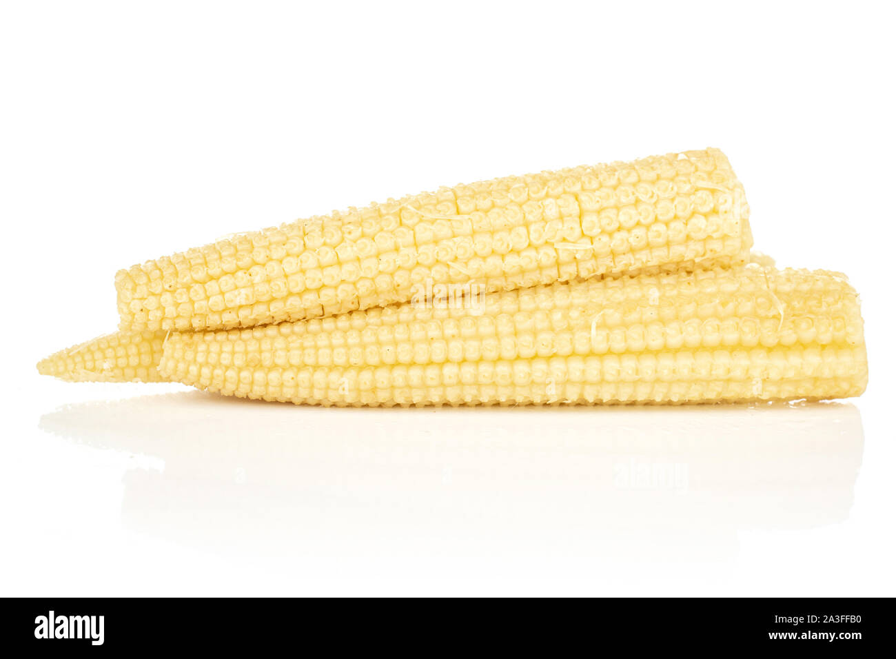 Group of three whole baby yellow corn isolated on white background ...