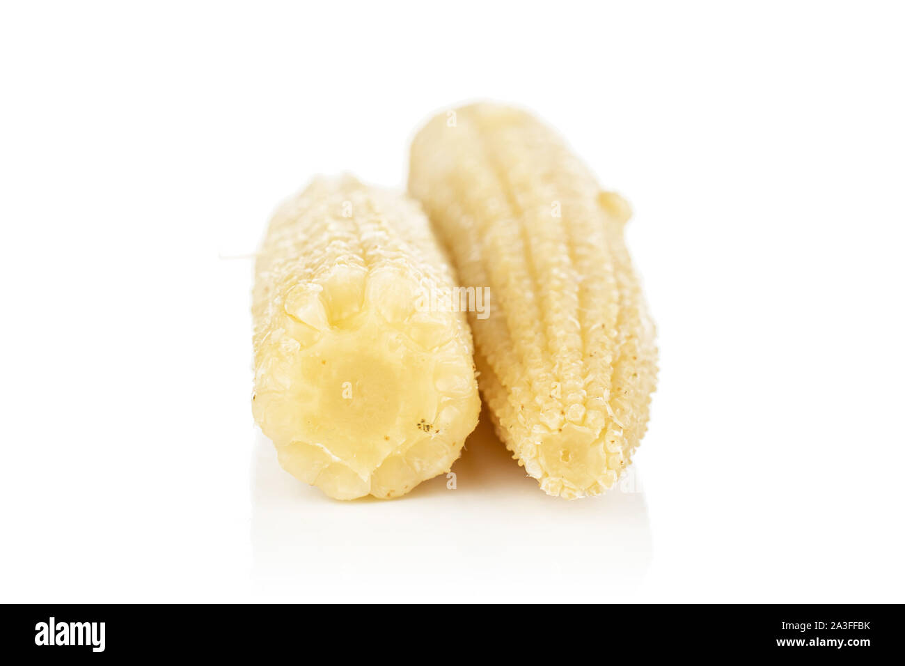 Group of two whole baby yellow corn isolated on white background Stock ...