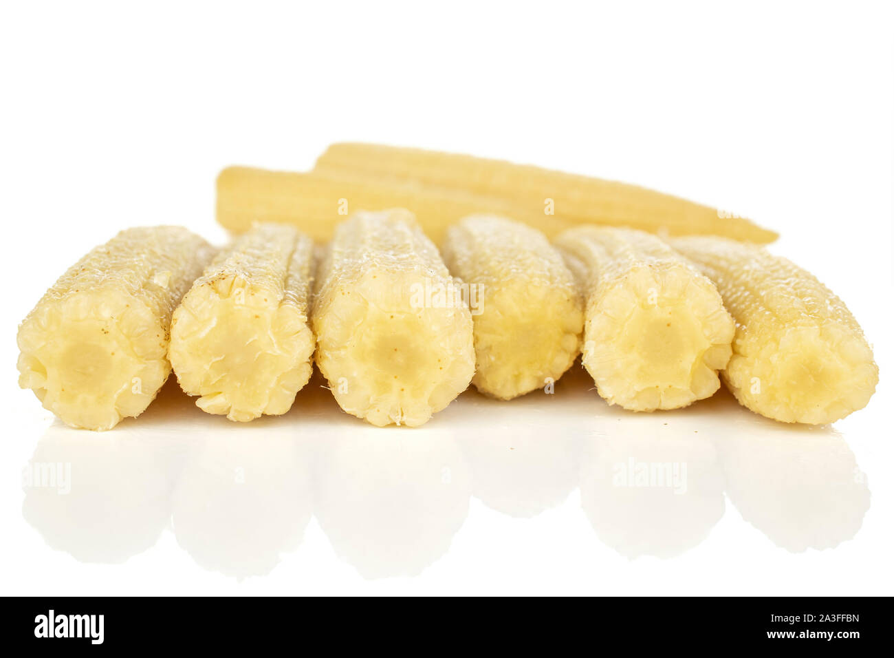 Group of eight whole baby yellow corn isolated on white background ...