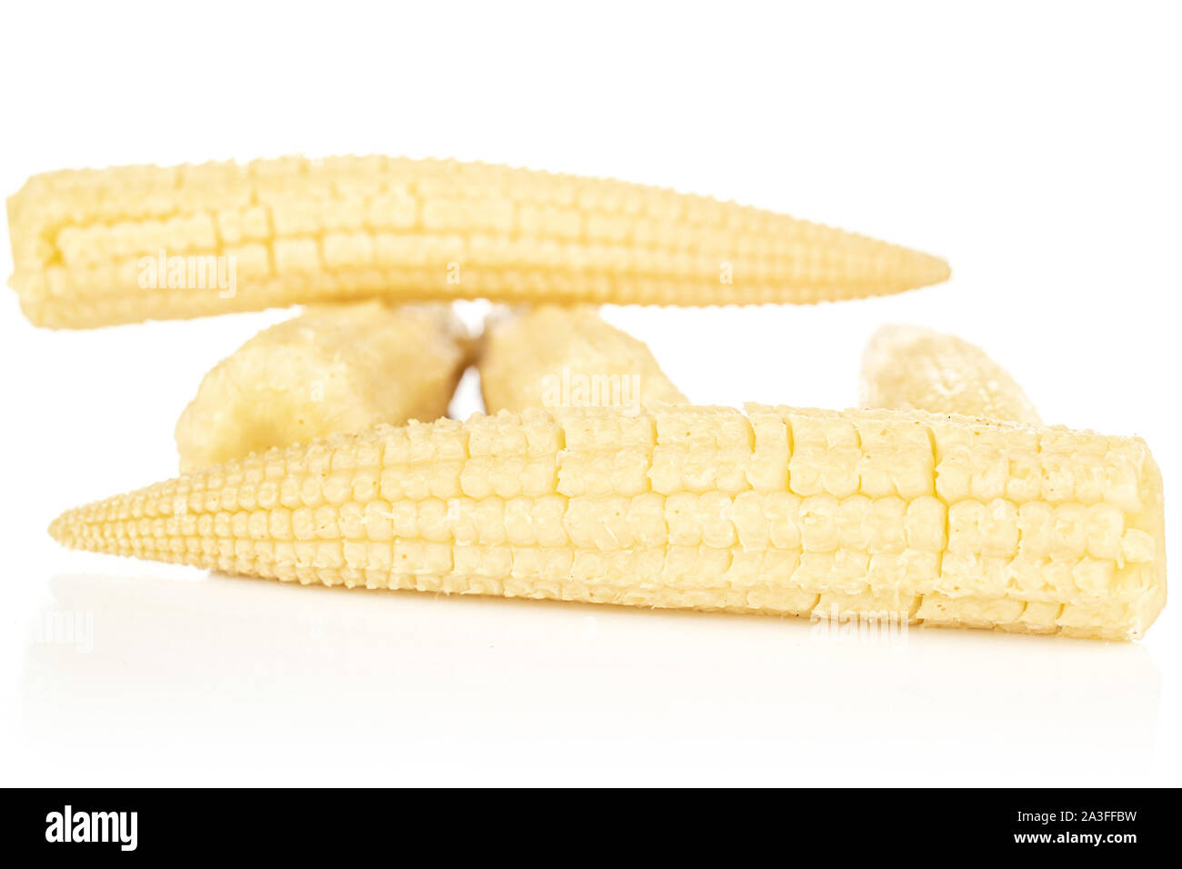 Group of five whole baby yellow corn isolated on white background Stock ...