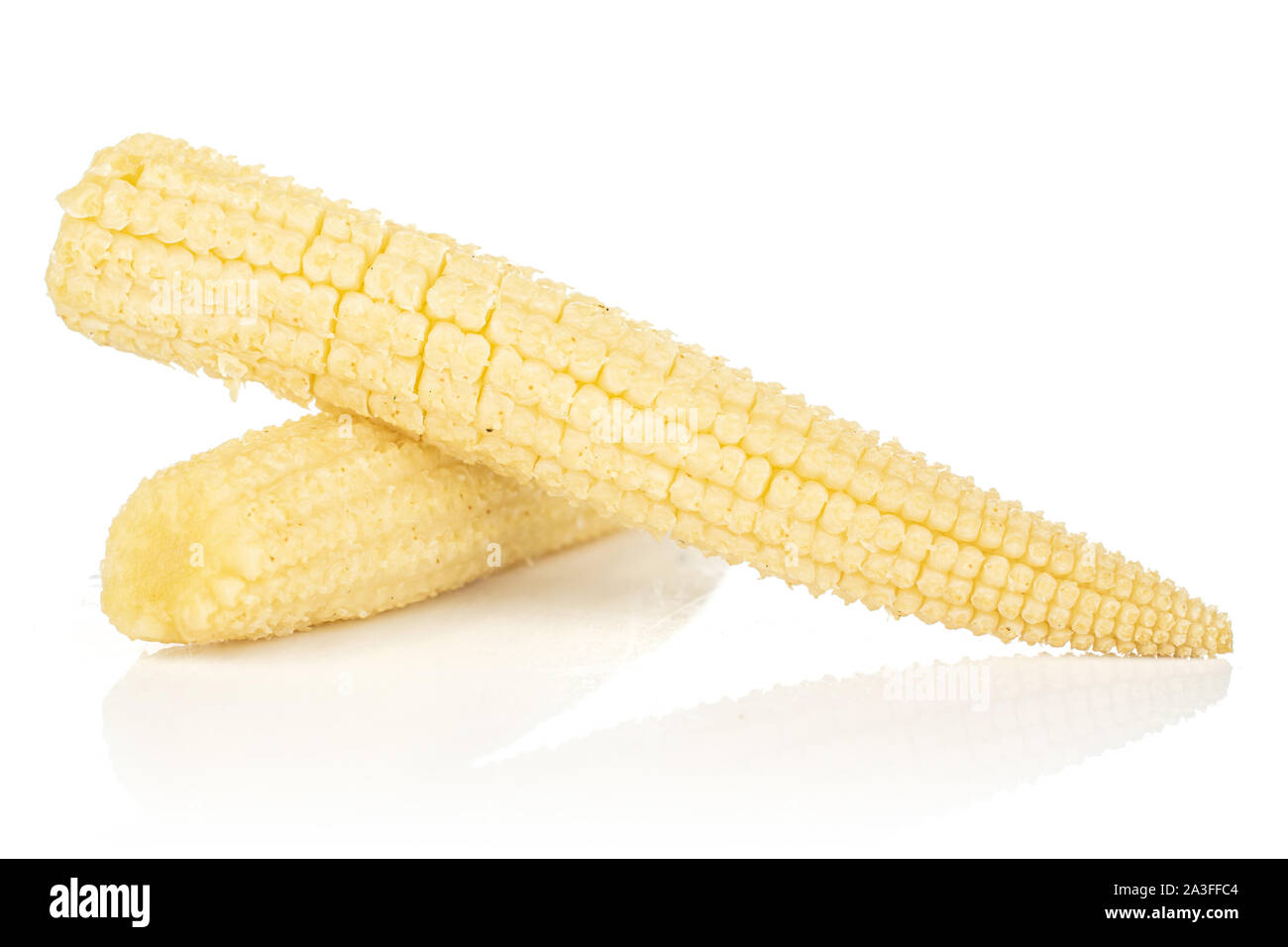 Group of two whole arranged baby yellow corn isolated on white ...