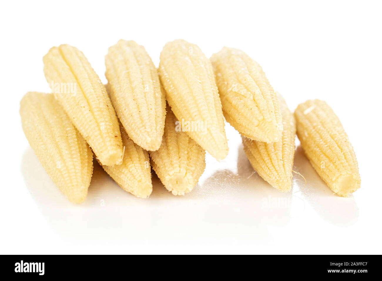 Group of nine whole baby yellow corn isolated on white background Stock ...