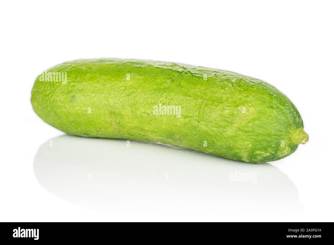 One whole mini green cucumber isolated on white background Stock Photo ...