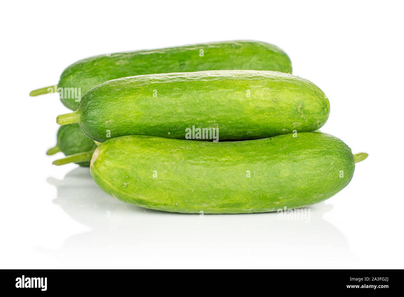 Lot of whole mini green cucumber isolated on white background Stock ...