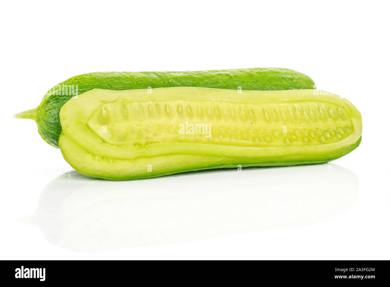 Group of one half one piece of mini green cucumber isolated on white ...