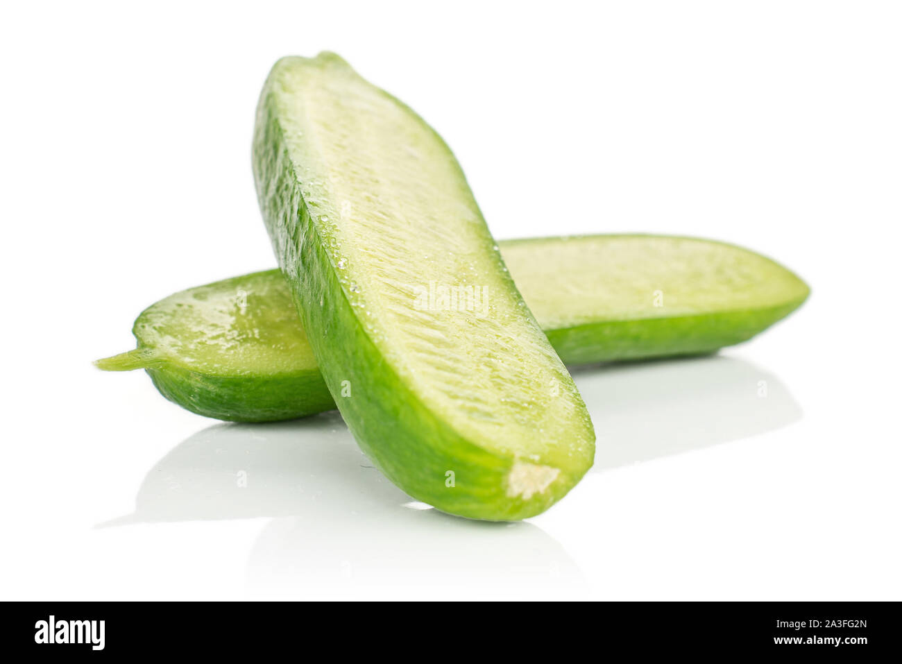 Group of two halves of mini green cucumber isolated on white background ...