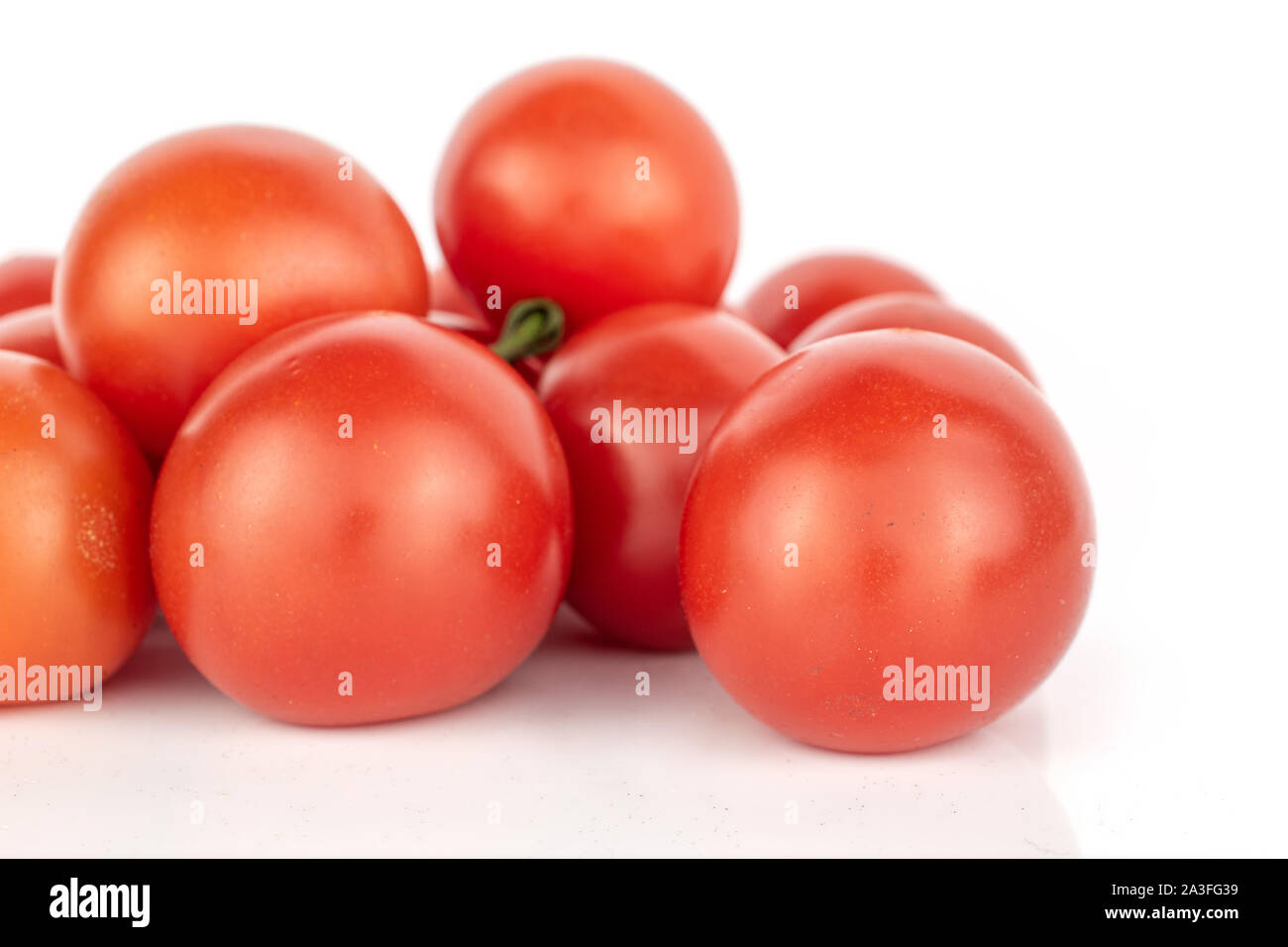 Lot of whole fresh red tomato heap isolated on white background Stock Photo - Alamy