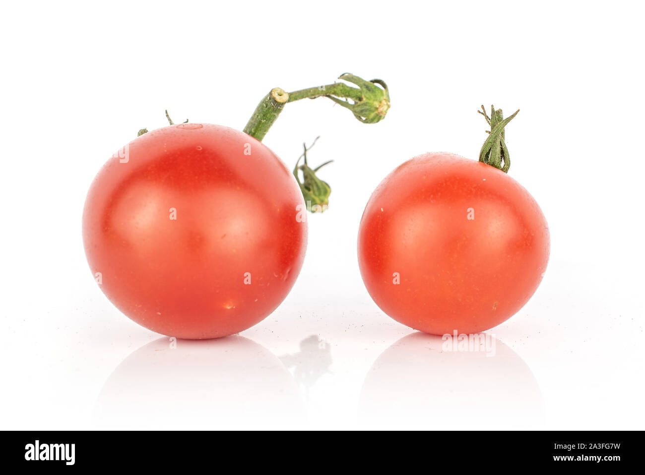 Group of two whole fresh red tomato front focus isolated on white ...