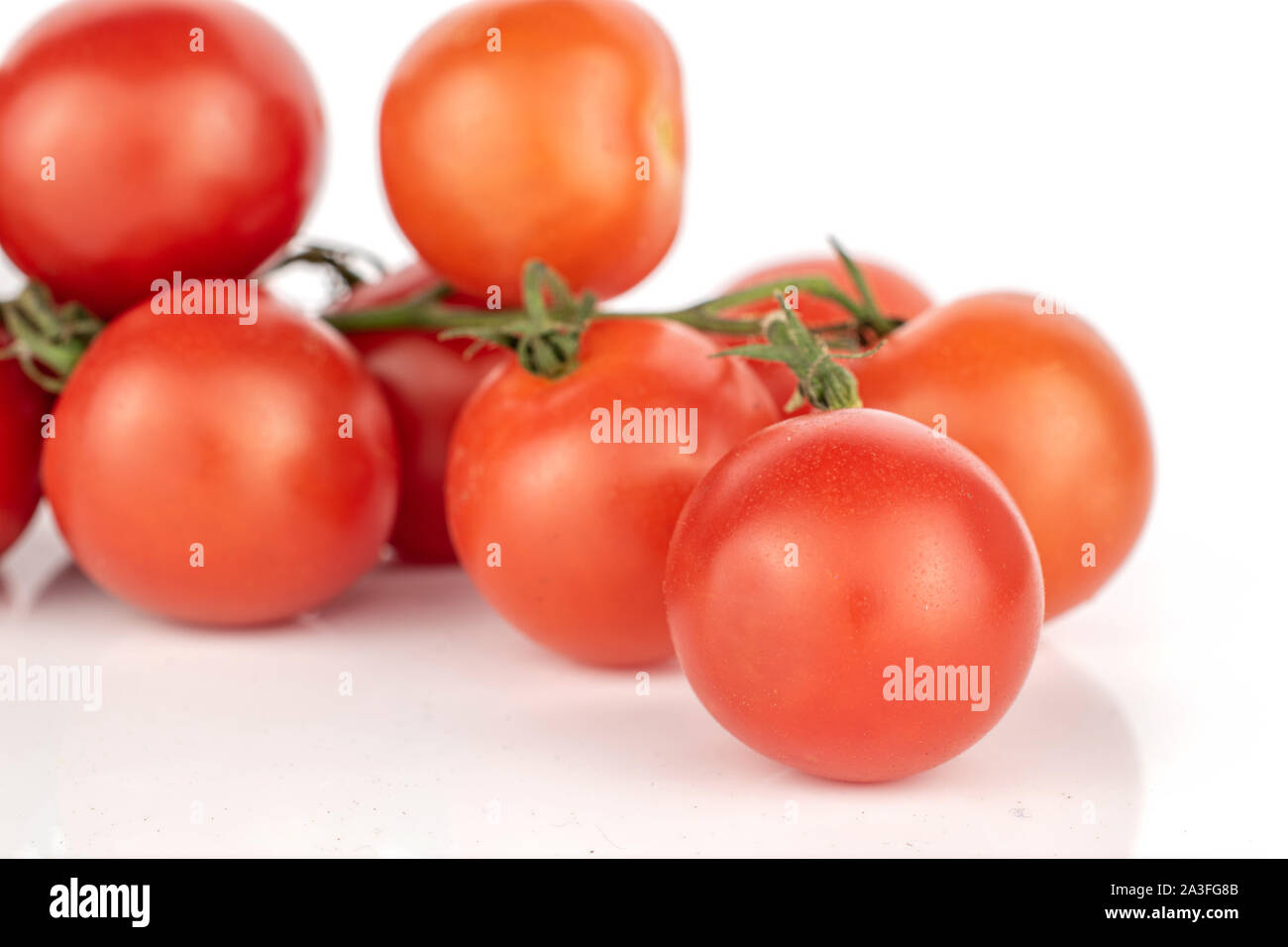 Lot of whole fresh red tomato cluster isolated on white background ...