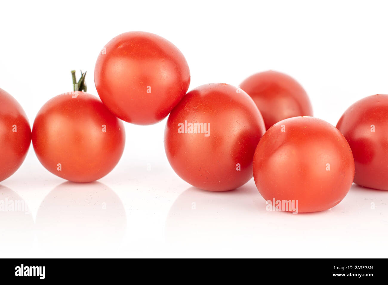 Group of seven whole fresh red tomato isolated on white background ...