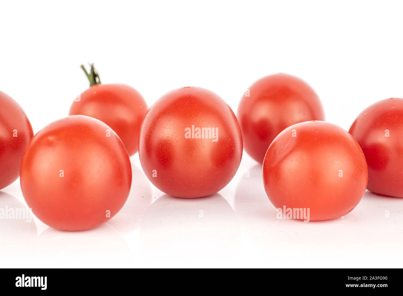 Group of seven whole fresh red tomato isolated on white background ...