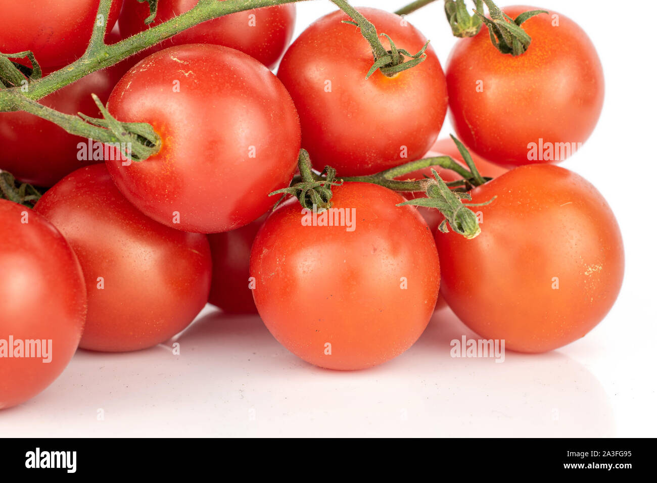 Lot of whole fresh red tomato cluster isolated on white background ...