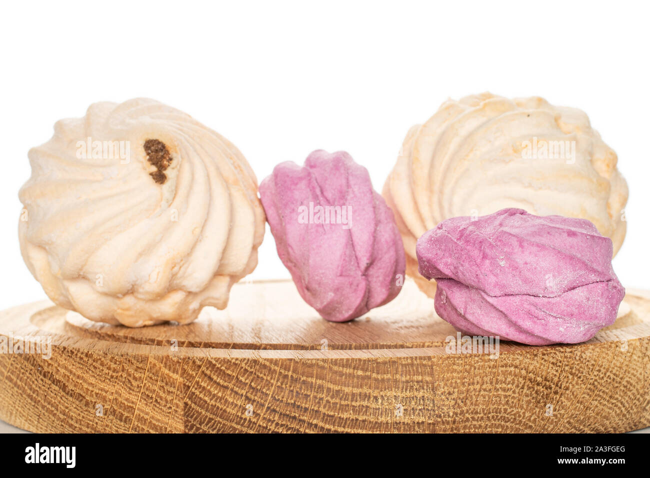 Group of four whole fresh pastel zefir on bamboo plate isolated on ...