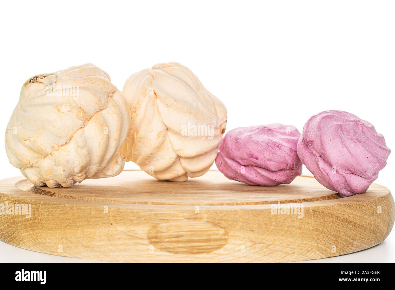 Group of four whole fresh pastel zefir on bamboo plate isolated on ...