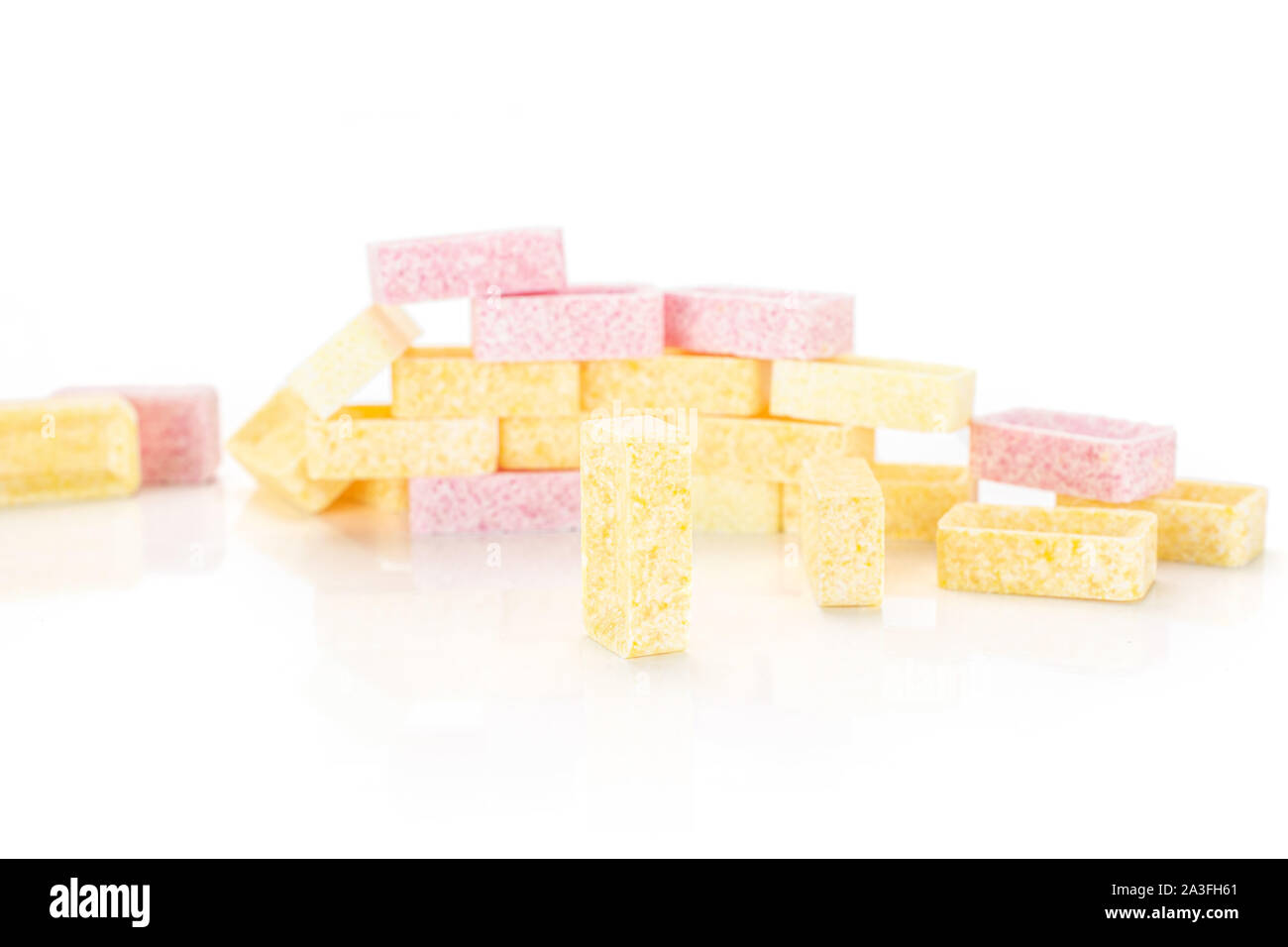 Damage lot of whole sweet pastel candy wall isolated on white ...