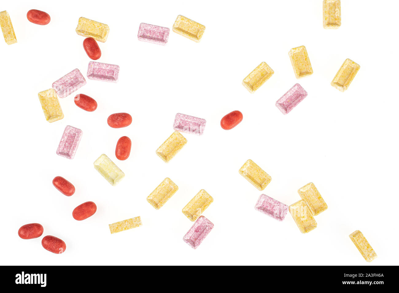 Lot of whole disordered sweet pastel candy flatlay isolated on white ...