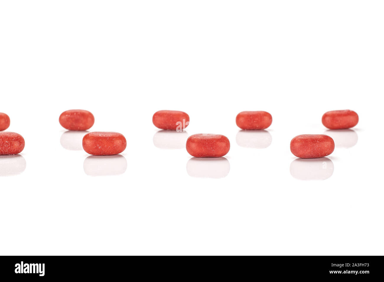 Lot of whole sweet pastel candy i row isolated on white background ...