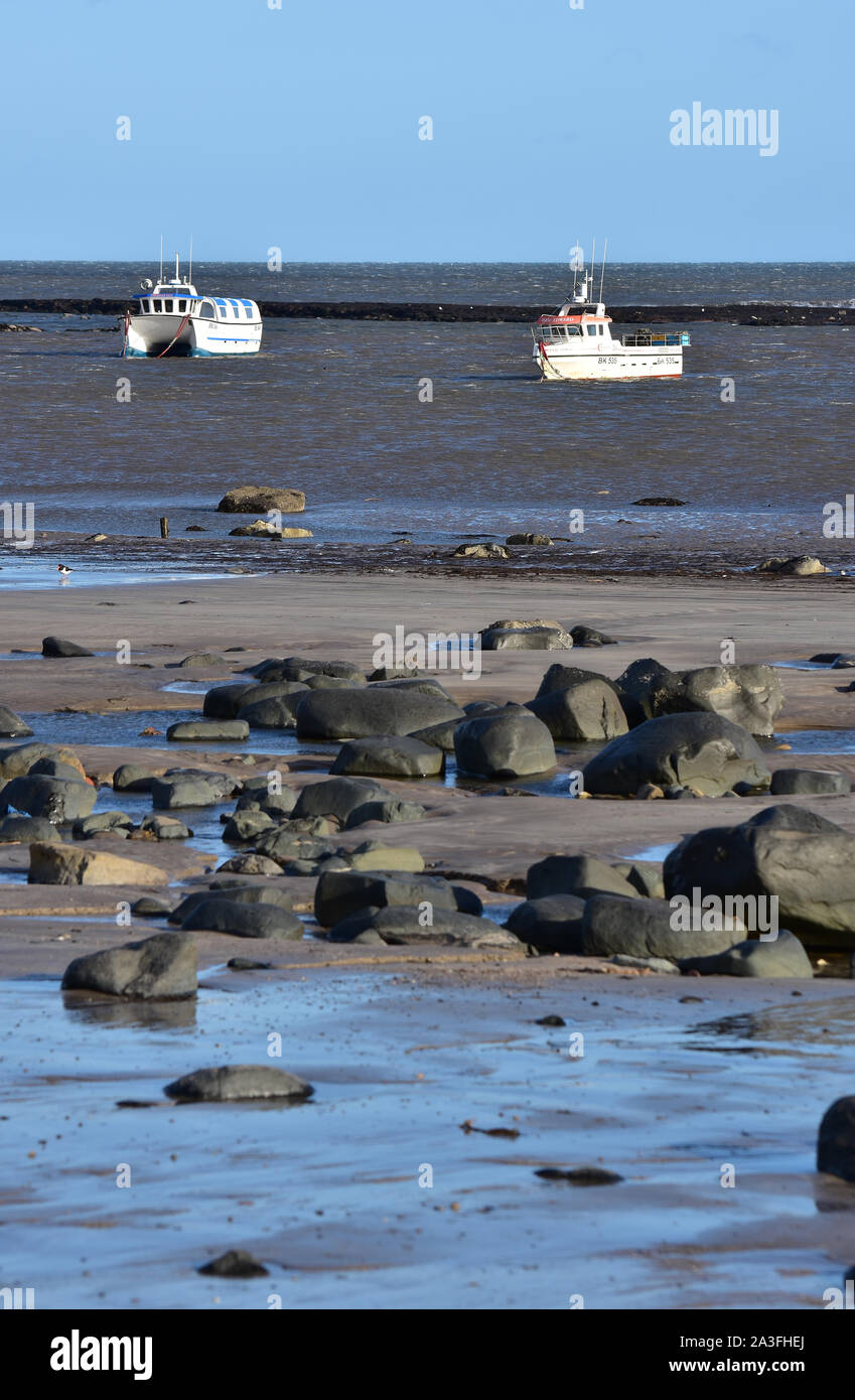Rocky beach and boats, Boulmer, Northumberland Stock Photo - Alamy
