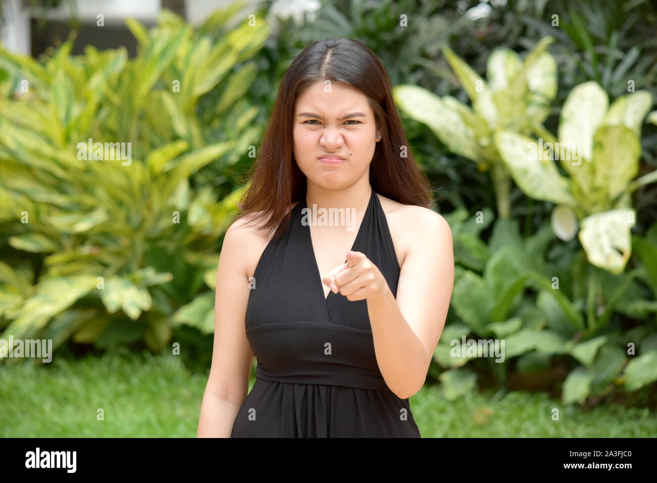 An Upset Youthful Asian Female Stock Photo - Alamy