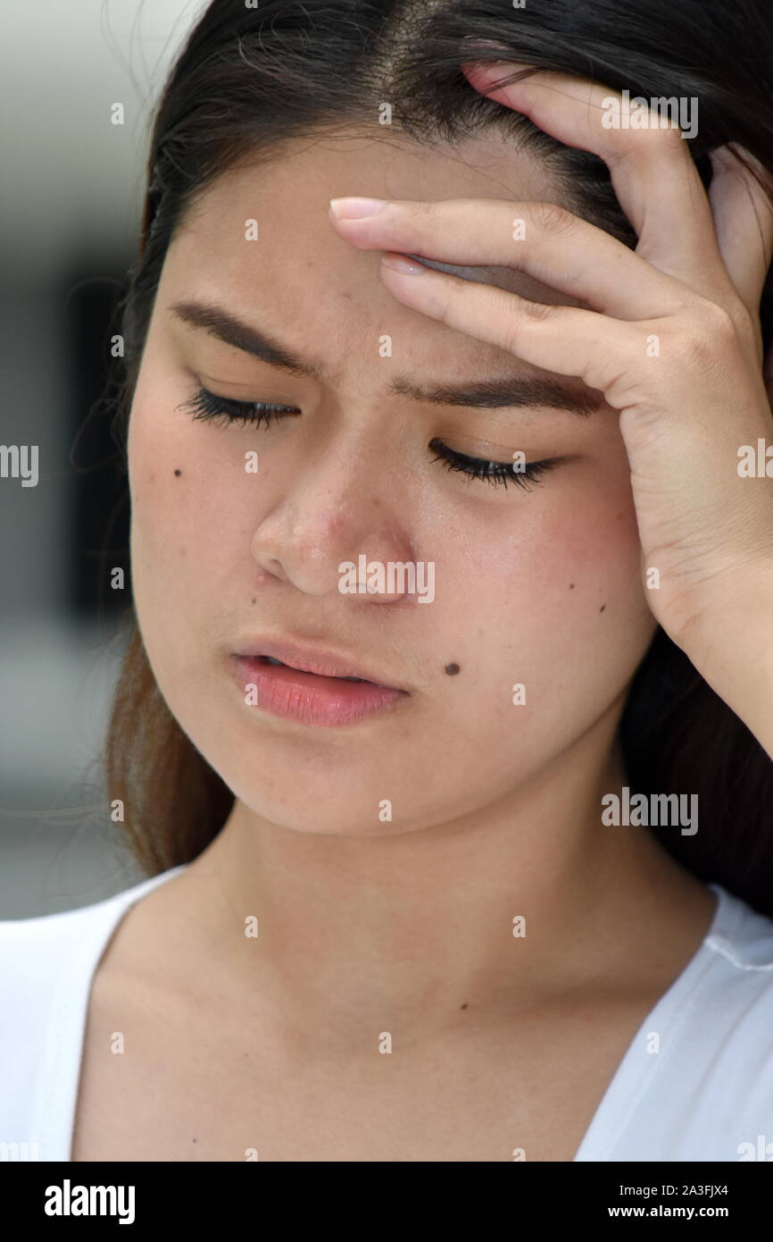 A Worried Young Filipina Person Stock Photo - Alamy