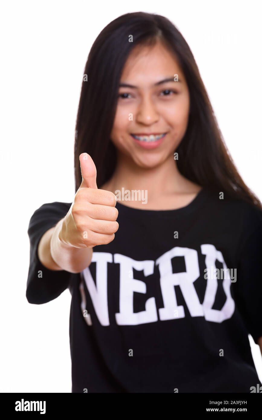 Studio shot of young happy Asian teenage nerd girl smiling and g Stock ...