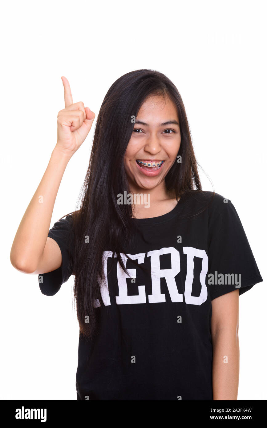 Studio shot of young happy Asian teenage nerd girl smiling while Stock Photo - Alamy