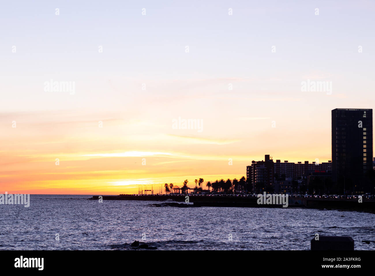 Sunset at La Rambla Argentina, Montevideo waterfront Stock Photo - Alamy