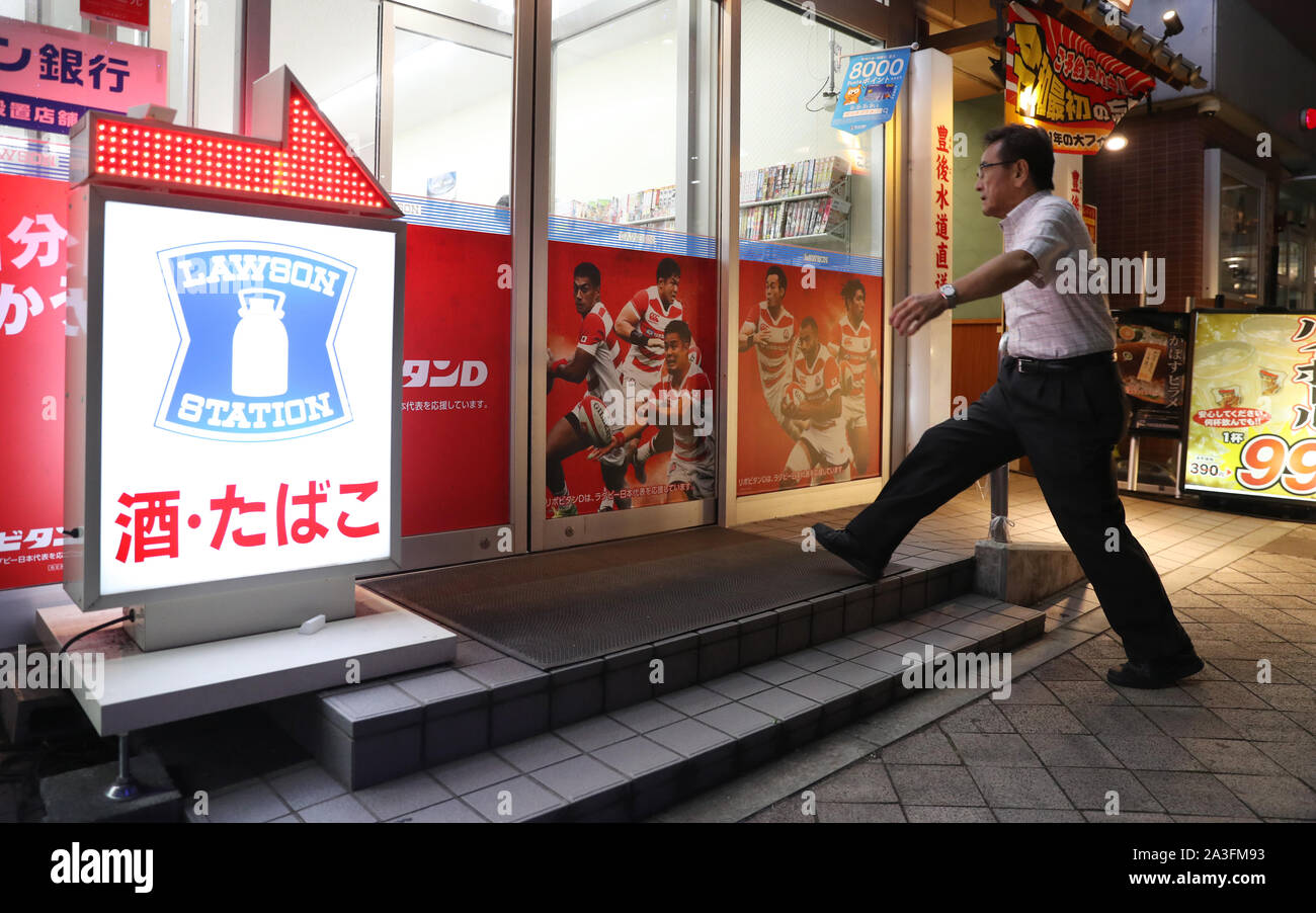 A man enters a Lawson convenience store with Japan Rugby World Cup ...