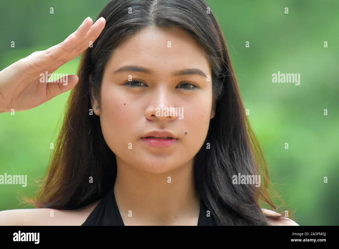 A Pretty Female Saluting Stock Photo - Alamy