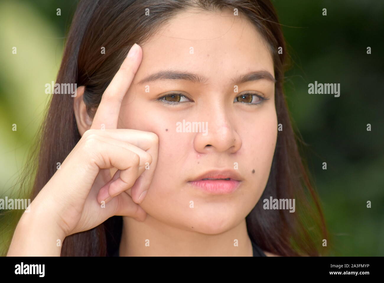 A Thoughtful Asian Person Stock Photo - Alamy