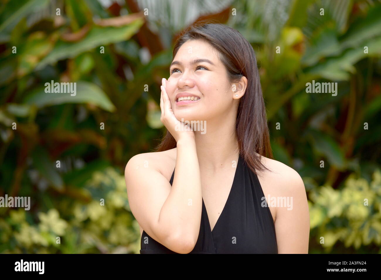 A Contemplative Young Diverse Female Stock Photo - Alamy