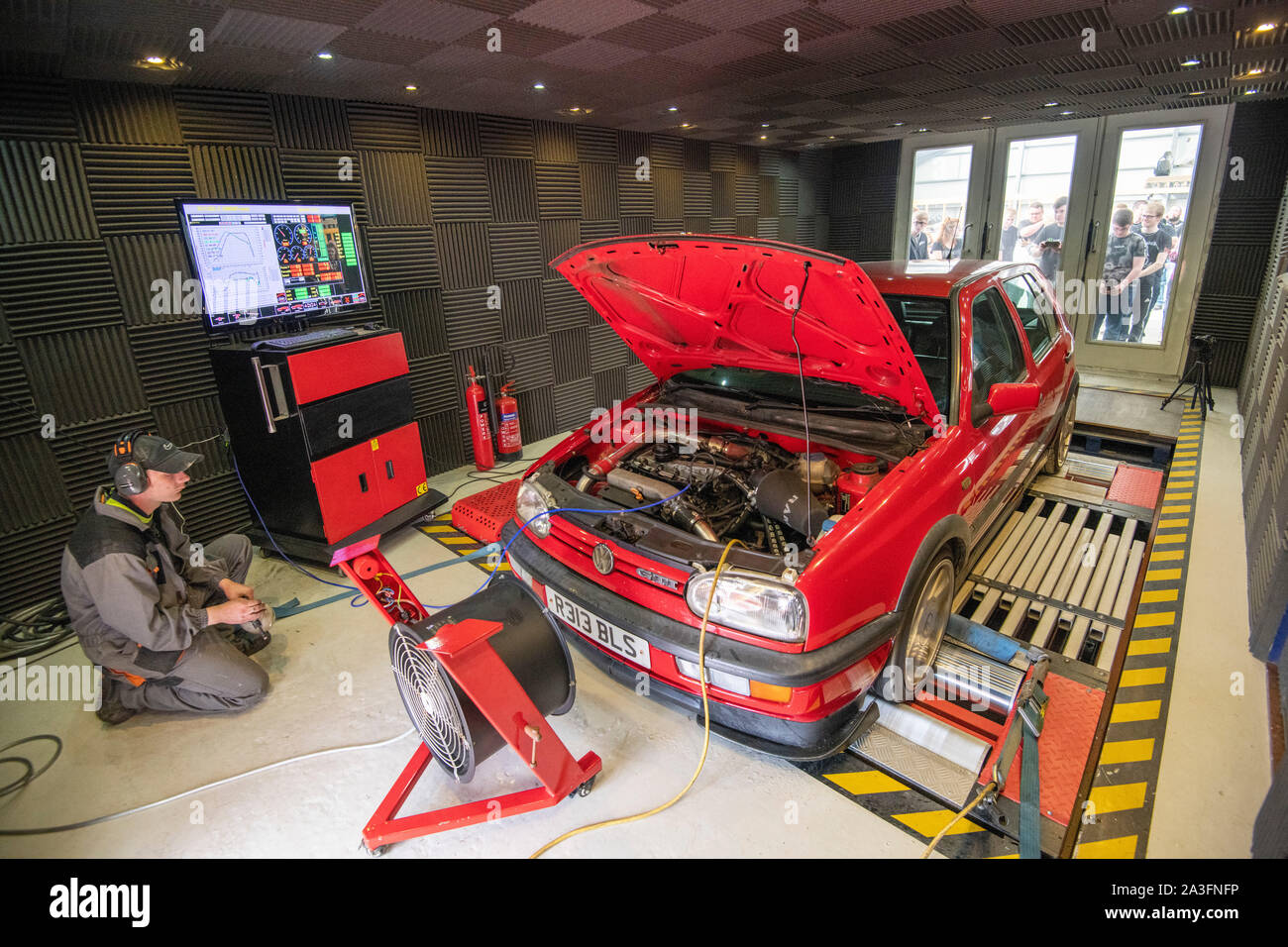 Car on a rolling road being tuned up on a dyno for performance and EDU ...