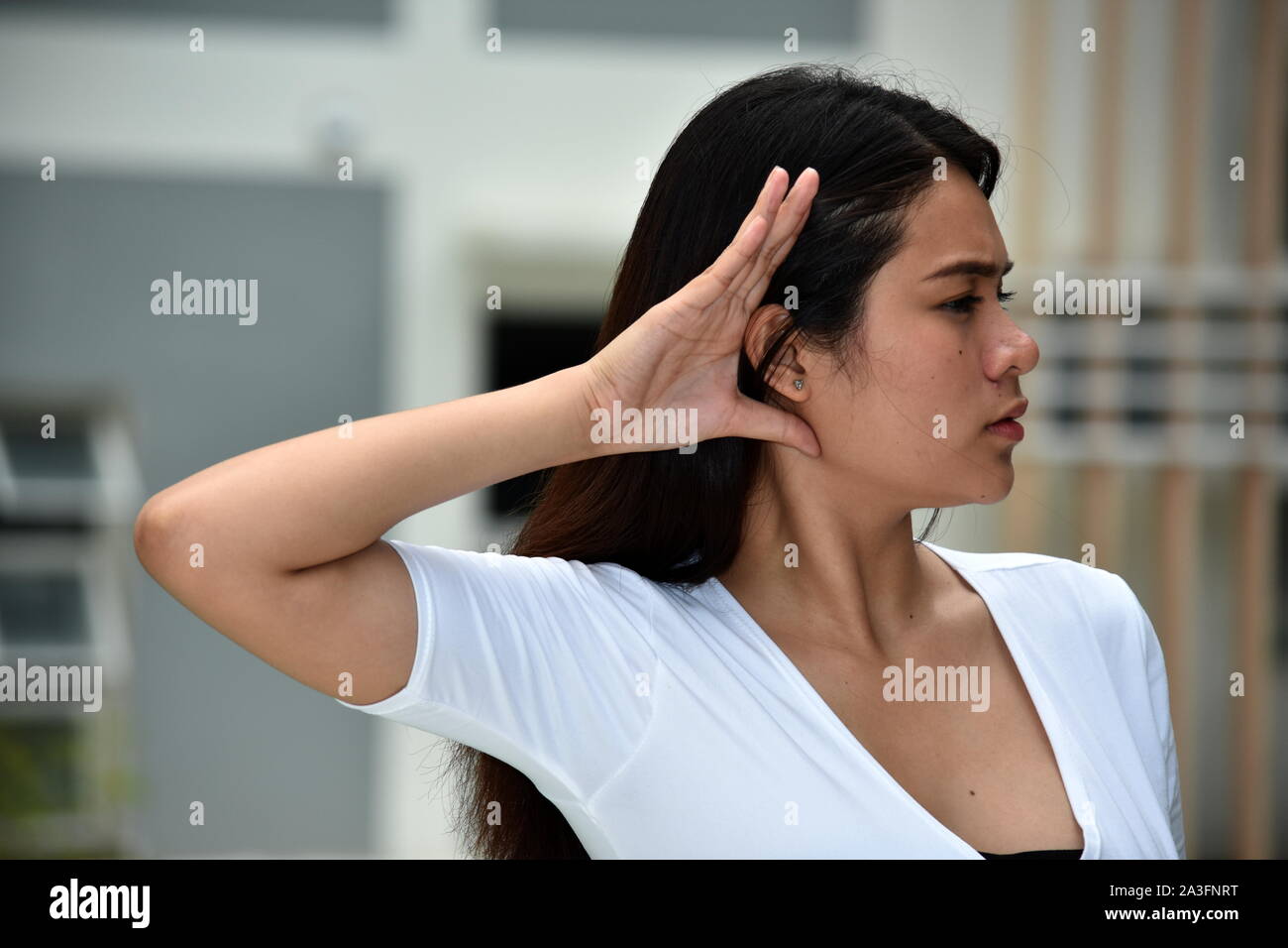 An Adult Female Listening Stock Photo - Alamy