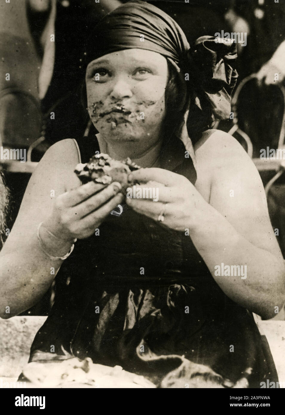 Female contestant in the pie eating contest, at the National Bathing ...