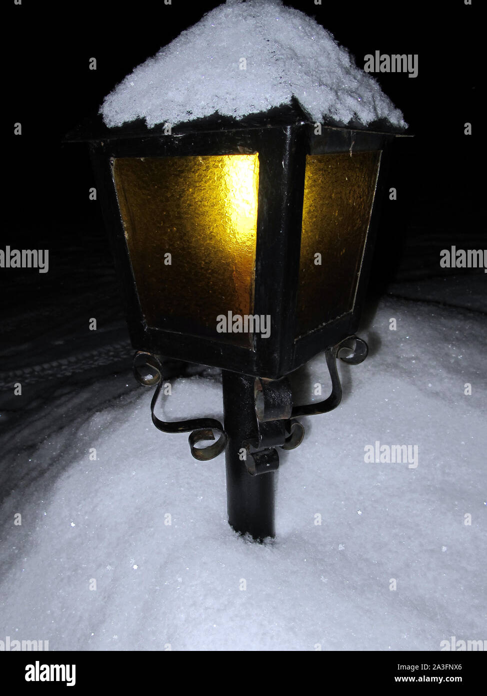 Burning lantern in the snow. Christmas lantern. Christmas lantern in ...