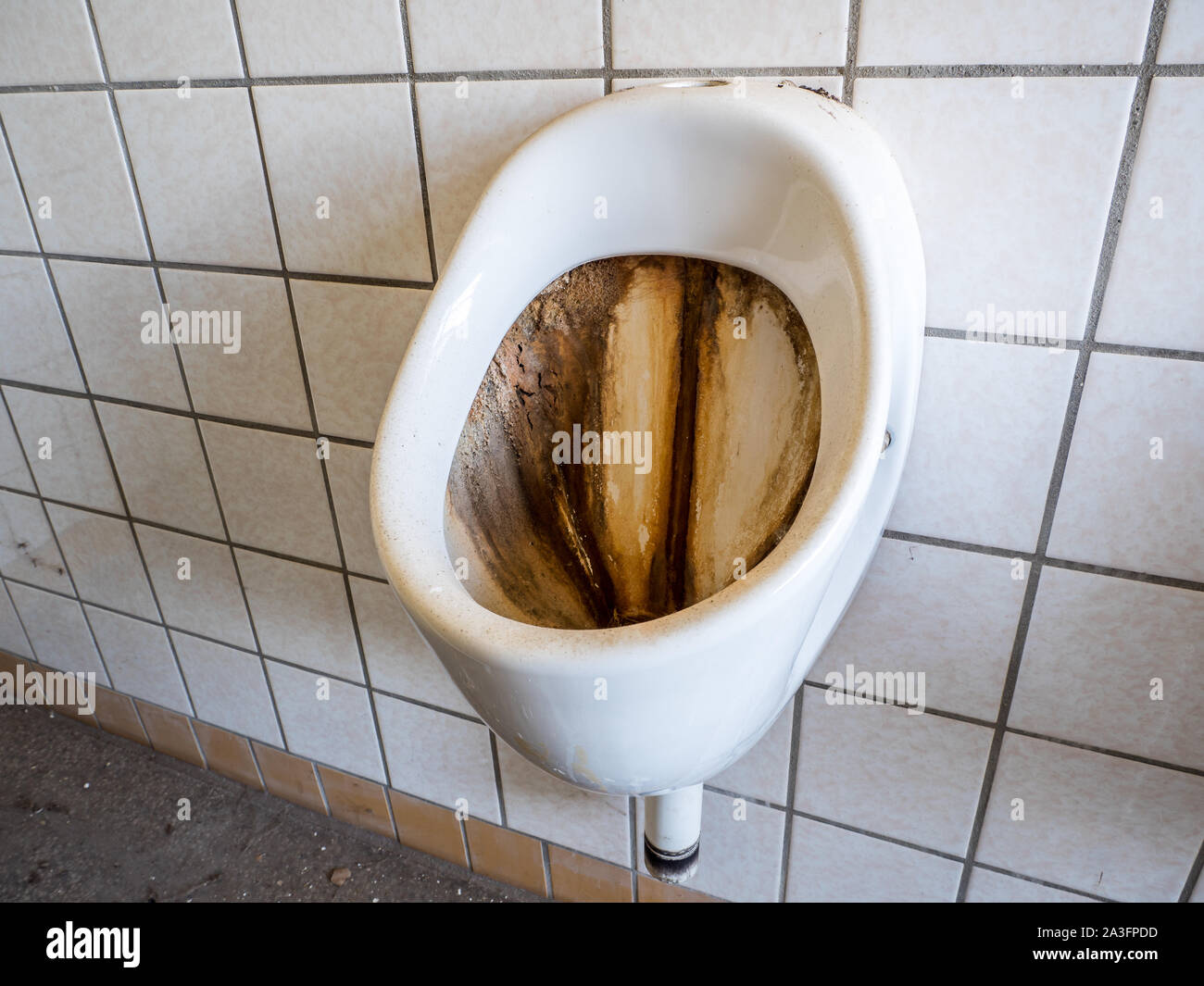 Old urinal Time for something new Stock Photo - Alamy
