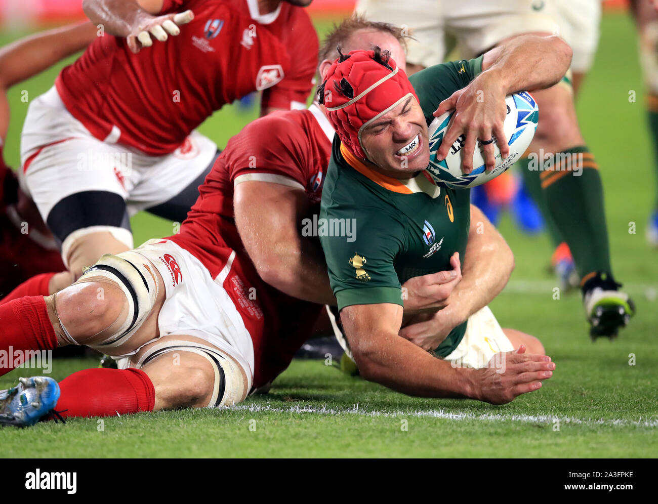 South Africa's Schalk Brits (right) scores his team's eighth try during ...