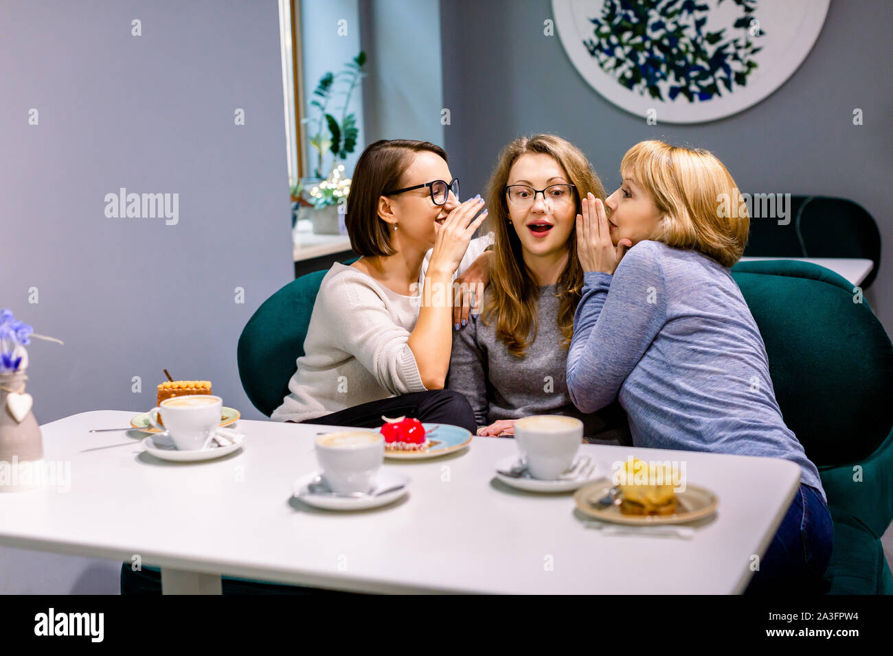 Gossips with best friends. Horizontal shot of two beautiful women ...
