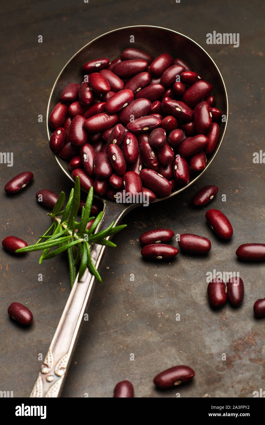 Raw red beans in a ladle on rusty table Stock Photo - Alamy