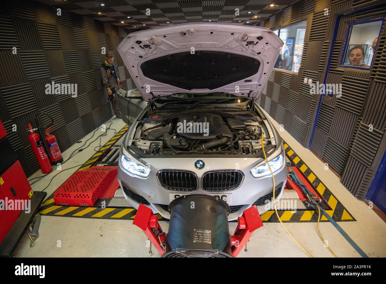 Car on a rolling road being tuned up on a dyno for performance and EDU ...