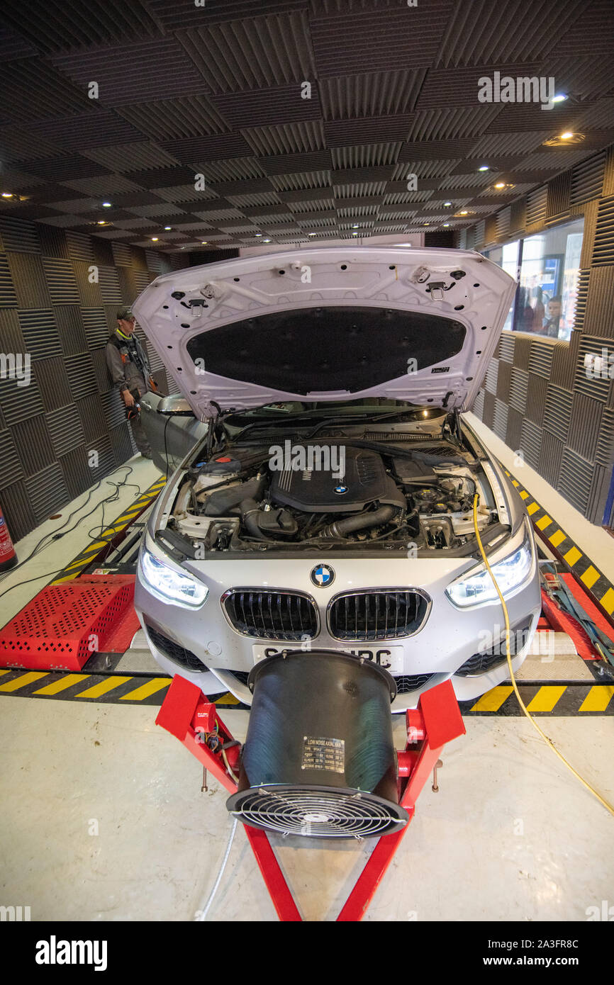 Car on a rolling road being tuned up on a dyno for performance and EDU ...