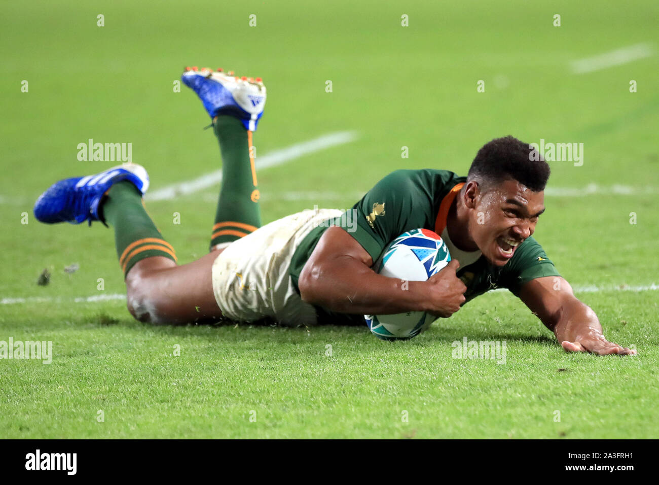 South Africa's Damian Willemse scores his team's ninth try during the ...