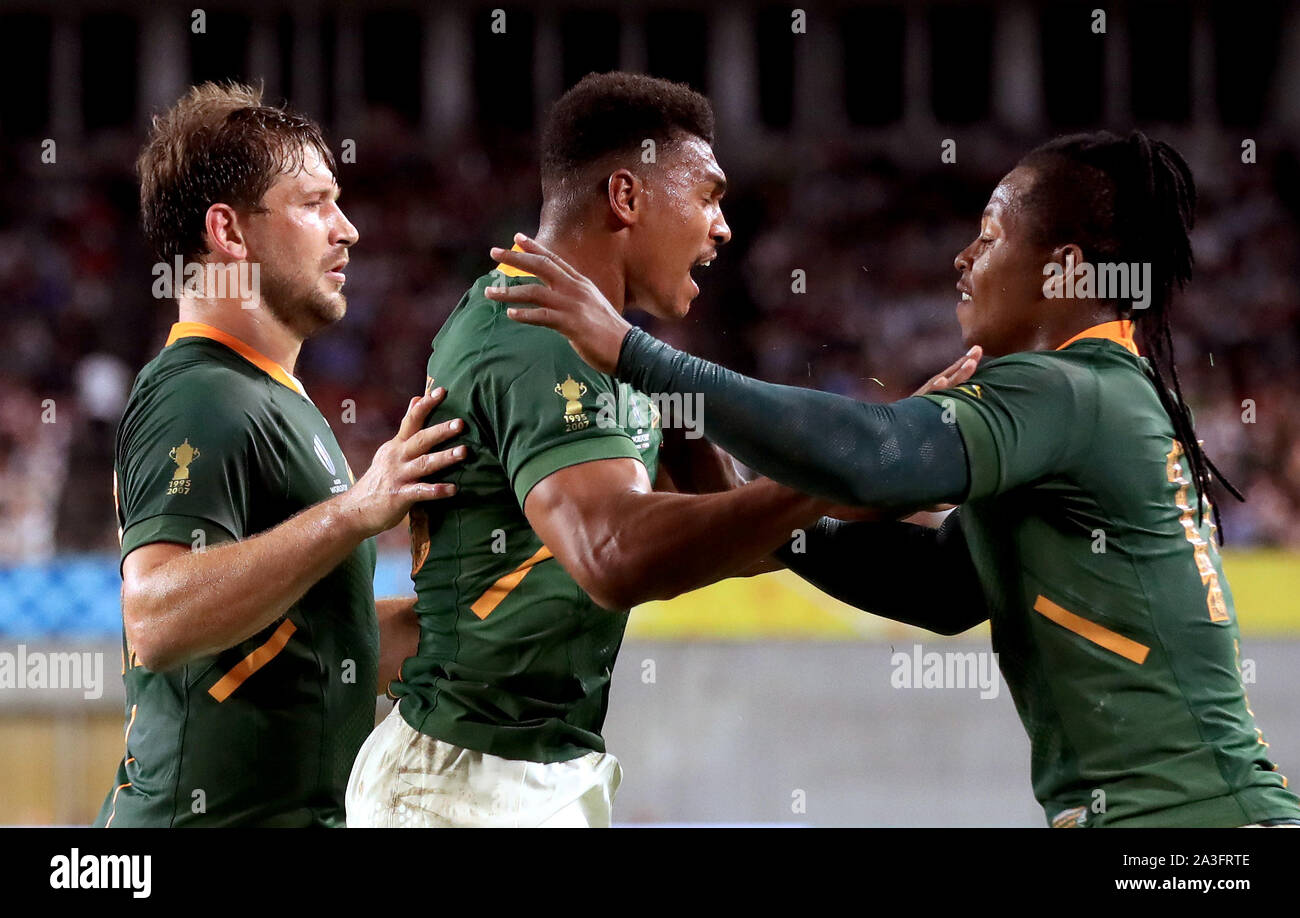 South Africa's Damian Willemse (centre) celebrates scoring his team's ...