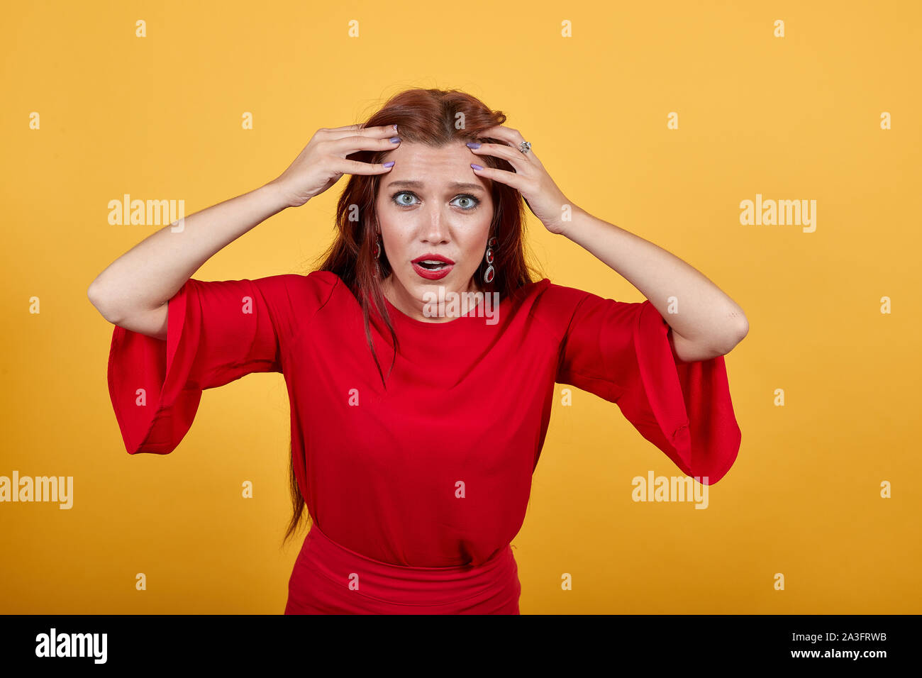 Lovely woman holding her hands shows embarrassment Stock Photo - Alamy